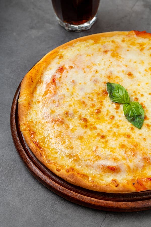 Italian Pizza with Four Cheeses and Lots of Mozzarella on a Cutting ...
