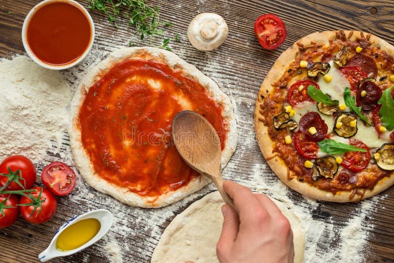 Italian pizza preparation. stock photo. Image of ketchup - 63056840