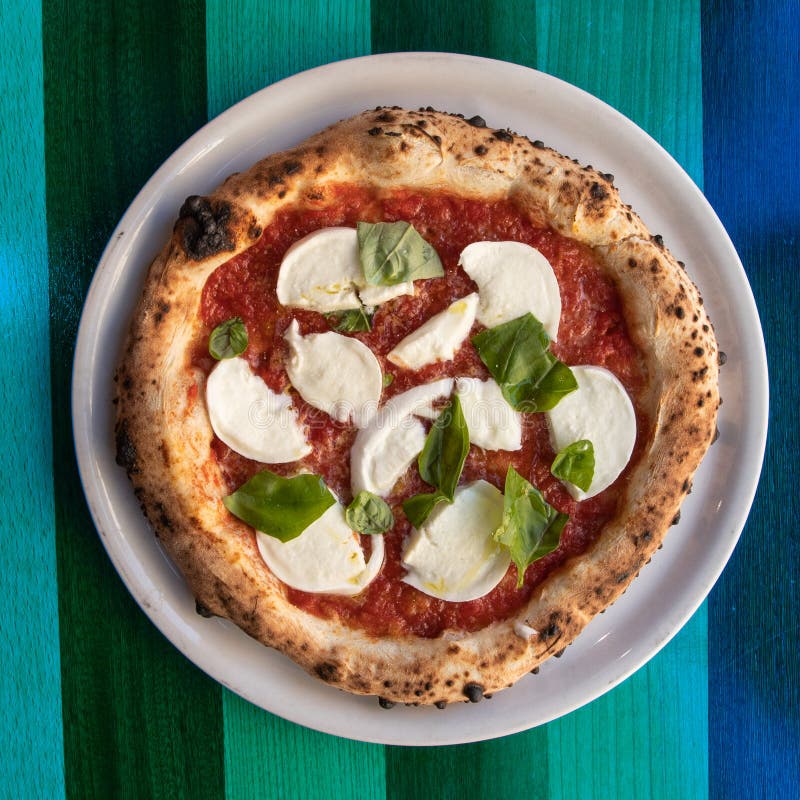 Italian Pizza in Restaurant Stock Photo - Image of tasty, circle: 241123608