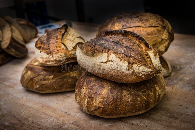Still Life of Various Delicious Homemade Breads on a Wooden Surface ...