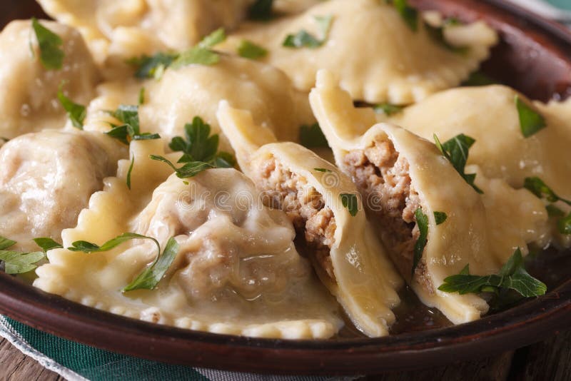 Italian Ravioli with Meat Closeup on a Brown Plate. Horizontal Stock ...