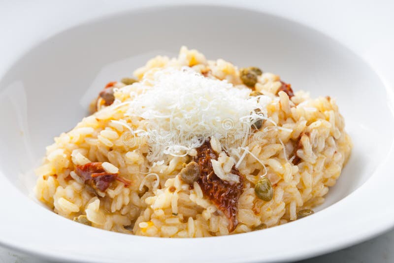 Italian Risotto with Dry Tomatoes and Capers Stock Photo - Image of ...