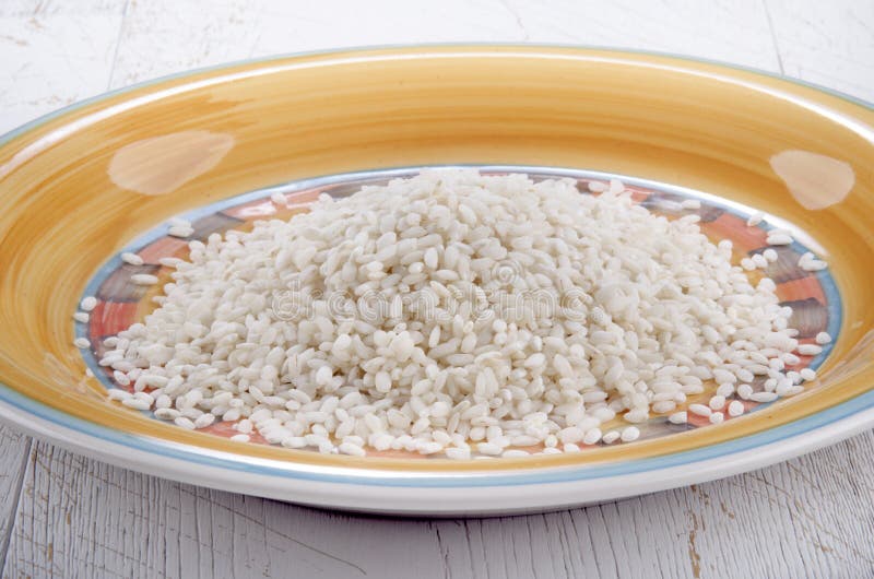 Italian Risotto Rice on a Plate Stock Image - Image of uncooked, rice ...