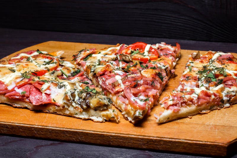 Italian Rustic Pizza, Three Pieces on a Wooden Tray, Dark Wooden Table ...