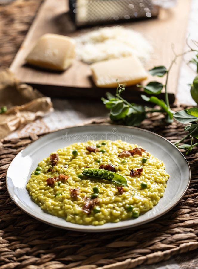 Italian Saffron Risotto with Peas and Bacon Creatively Served on a ...