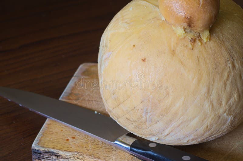 Italian seasoned cheese stock photo. Image of cutting - 68050344