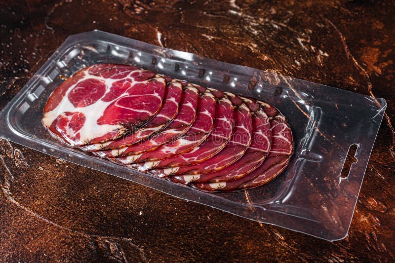 Italian Sliced Cured Coppa Meat in Vacuum Packaging. Dark Background ...