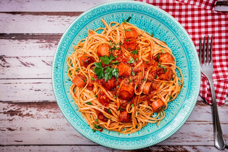 Italian Spaghetti and Sausages with Sauce on a Rustic Table. Top View ...