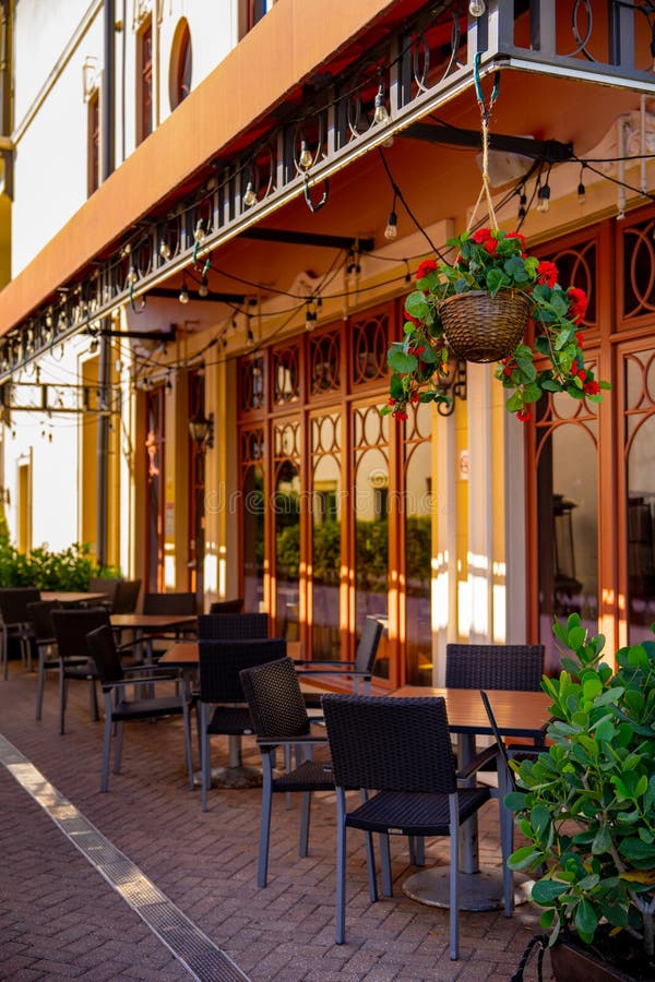 Italian Style Restaurant with Tables Under Awning Curbside Stock Image ...