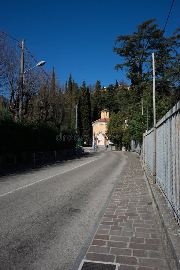 Italy, Menaggio, Lake Como, a Path Leading To a Brick Wall Stock Photo ...