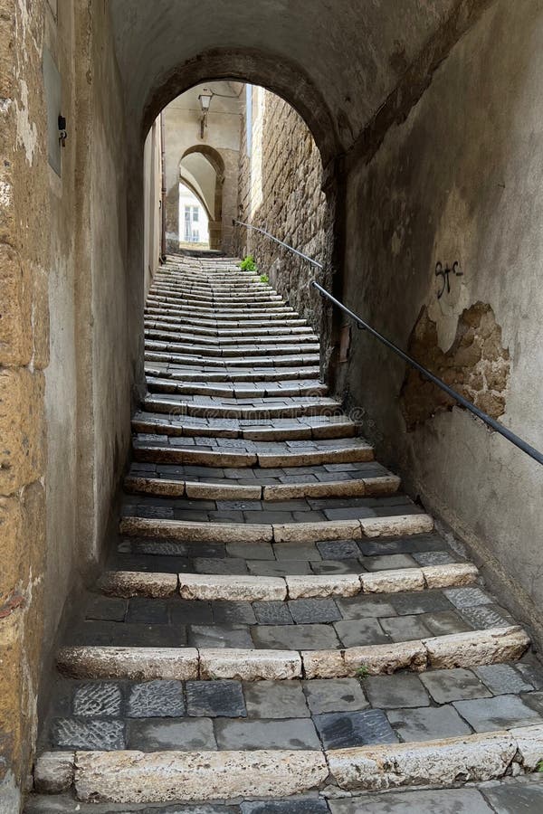 Long Line of Stairs in Alleyway with Archways in Pitigliano, Italy ...