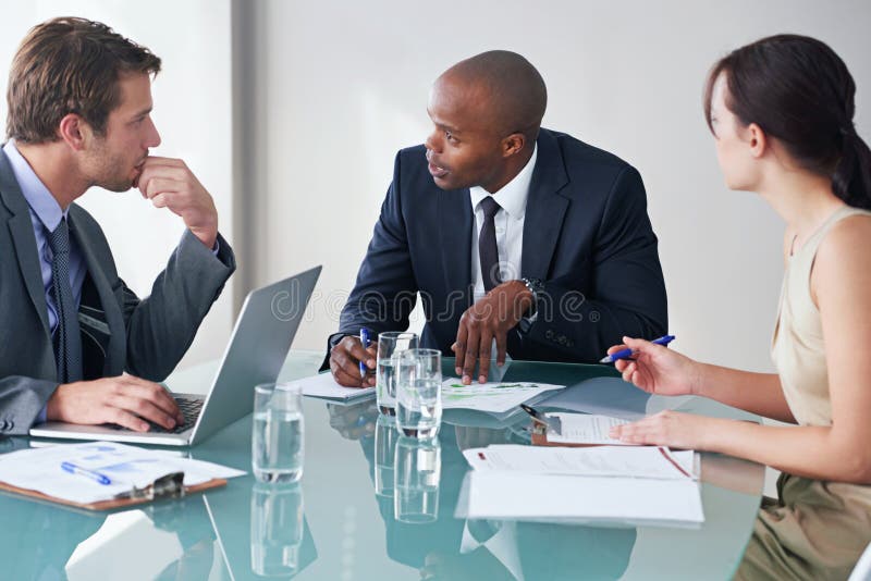 Its All about Strategy. Business Executives Having a Meeting at a ... Its All about Strategy. Business Executives Having a Meeting at a ...