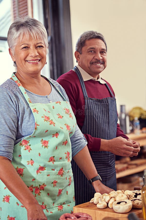 Its Better when we Cook Together. Shot of a Mature Couple Cooking ...