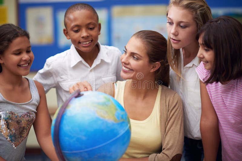 Its a Big World. a Teacher Teaching Her Students about the Globe in a ...