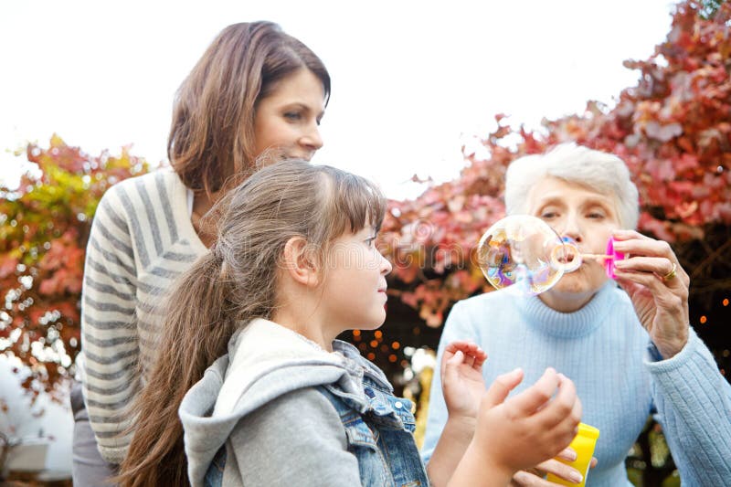 Its a Bubble Thing. a Three Generational Family Spending Time Outdoors ...