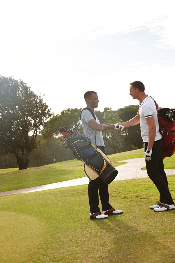 Its a Gentlemans Game. Two Young Men Shaking Hands on a Golf Course ...