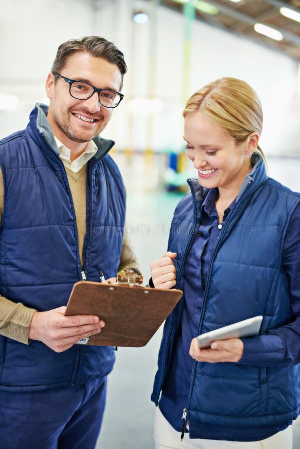 Its always Good To Have a Hard Copy. Two People Looking at Paperwork ...