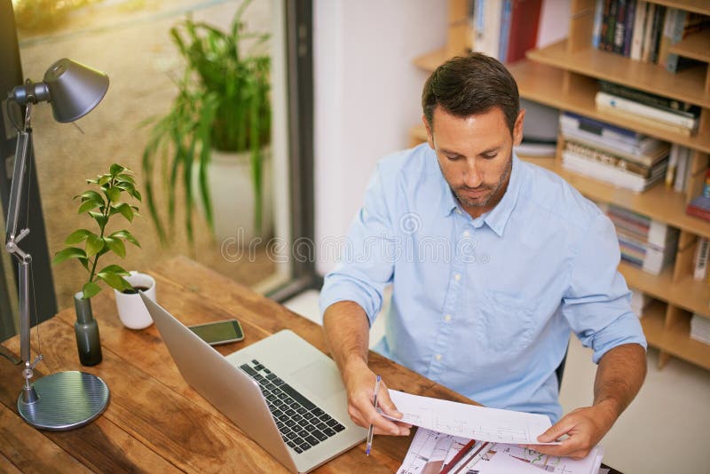Its Good To Keep Records. a Young Man Working from Home. Stock Photo ...