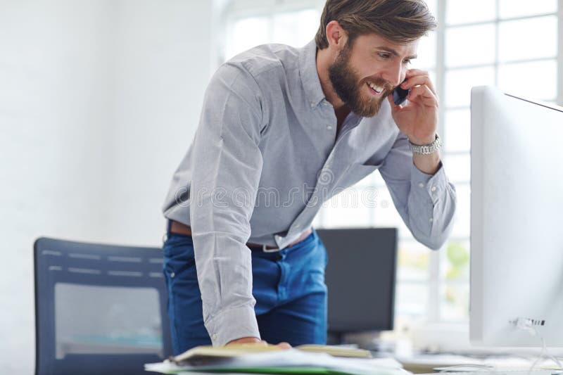 Its Looking Good. a Designer Talking on His Phone while Reading ...