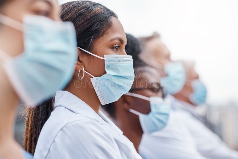 Its Not Easy Being a Frontline Worker. Closeup Shot of a Group of ...