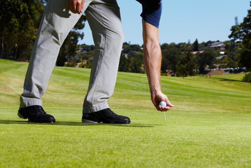 Its Tee-off Time. a Male Golfer Placing His Ball on a Tee. Stock Image ...