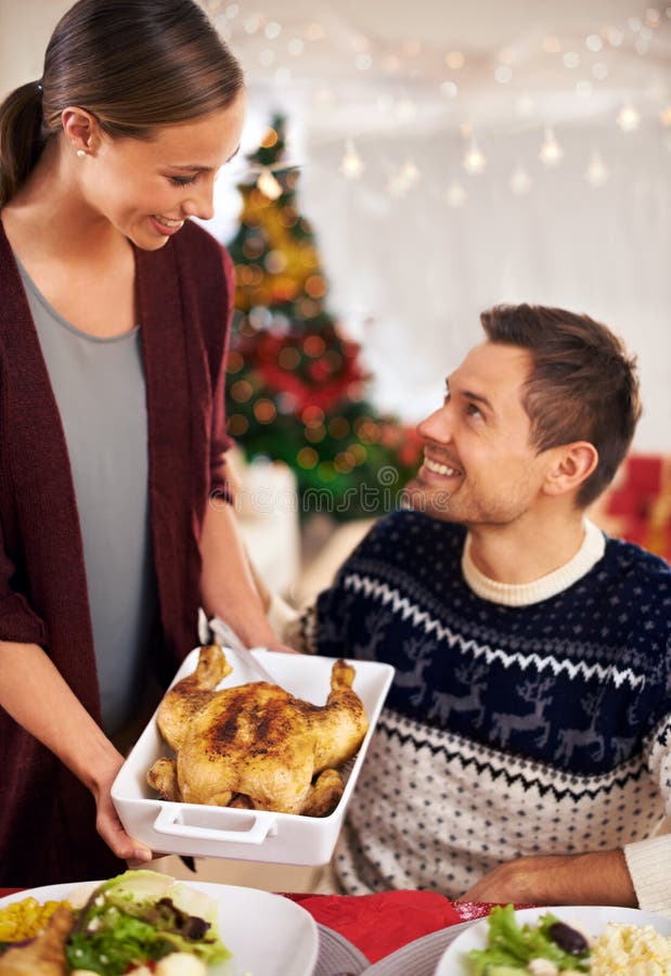 Its Time for a Christmas Feast. a Young Couple Eating Christmas Dinner ...