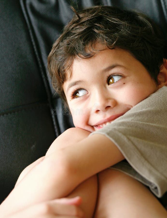 Ittle boy smiles cheekily stock image. Image of focus - 4696367