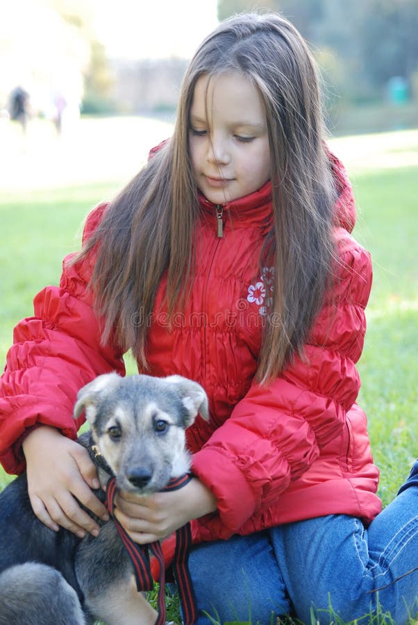 A Girl Holding a Rescue Dog in the Park at a Dog Show Editorial Image ...