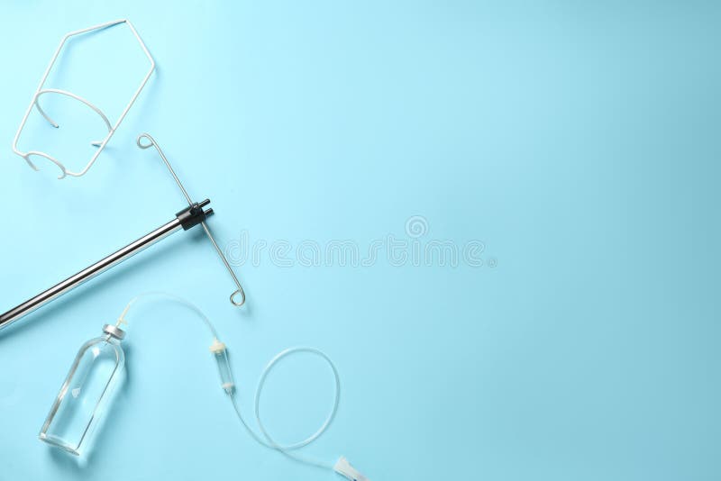 IV Infusion Set on Light Blue Background. Space for Text Stock Photo ...