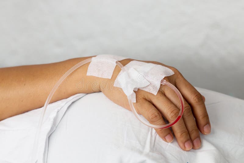 IV Solution in a Patients Hand Stock Photo - Image of healing, drip ...