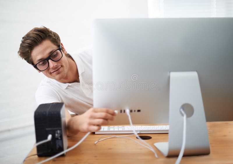 Ive Got this. a Young Man Plugging a Cable into His Computer. Stock ...