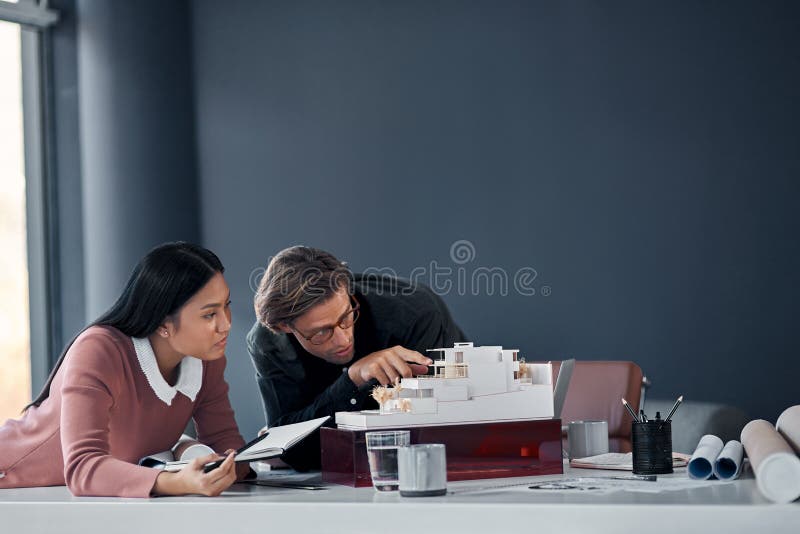 Ive Made Some Slight Adjustments Over There. Two Young Architects Working Together on a Scale ...