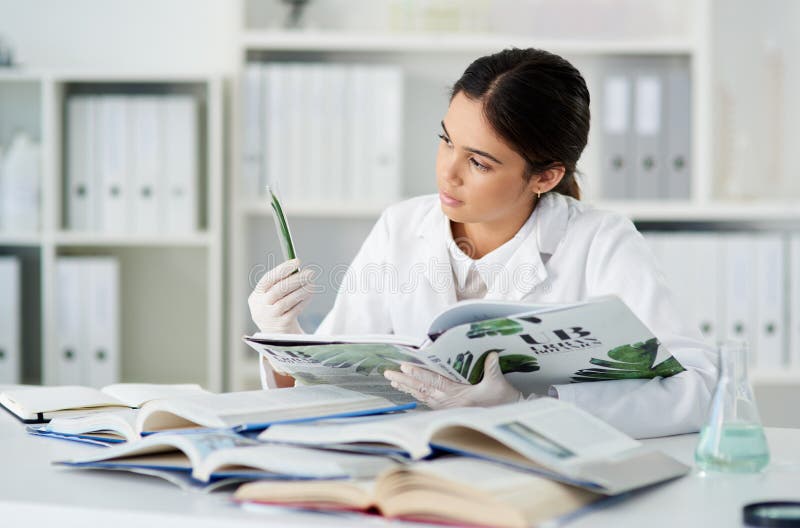 Ive Read about this Plant before. Shot of a Young Scientist Reading a ...