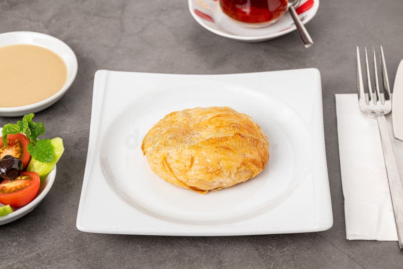 Izmir Boyoz on a White Porcelain Plate on a Stone Table Stock Image ...