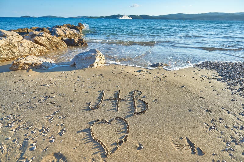 J Plus B with Heart Written on Sandy Beach Stock Photo - Image of ocean ...