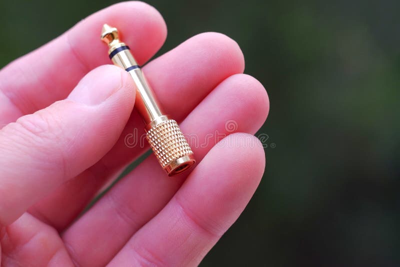 Jack Adapter between Finger Stock Photo - Image of cord, white: 125550092