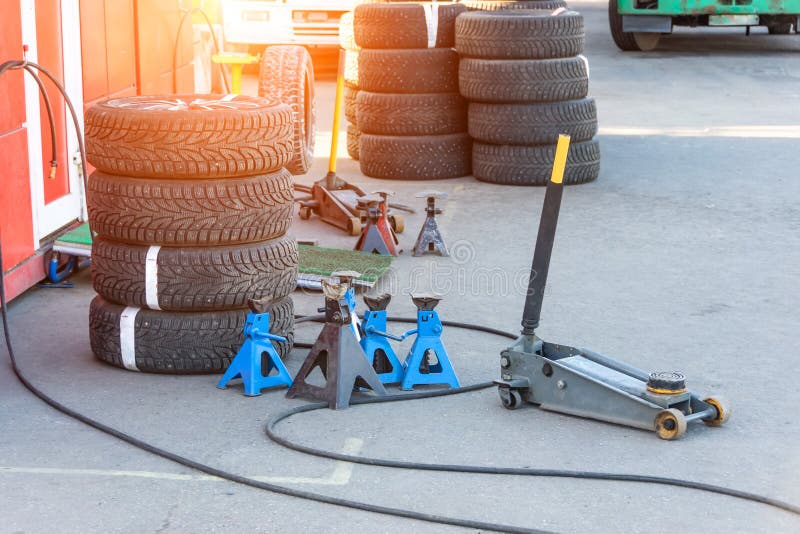 Jack for Lifting a Car Body To Replace Tires on Wheels Stock Photo ...