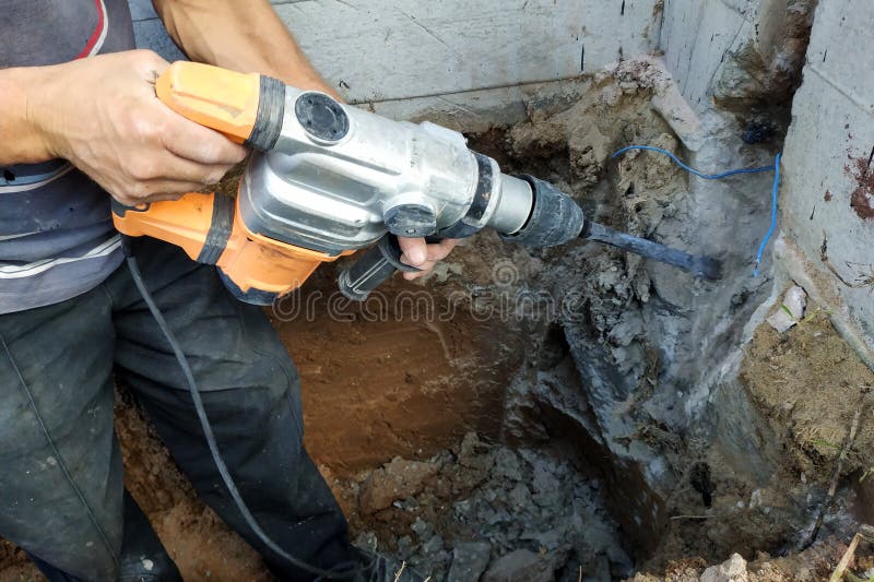 Jackhammer in Action, Pneumatic Construction Tool, Drilling a Hole in ...