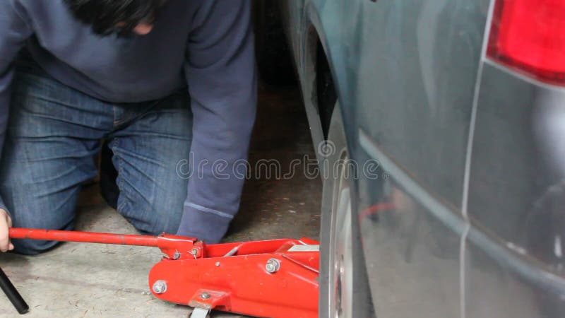 Jacking Up a Car in a Garage Stock Video - Video of mechanical ...