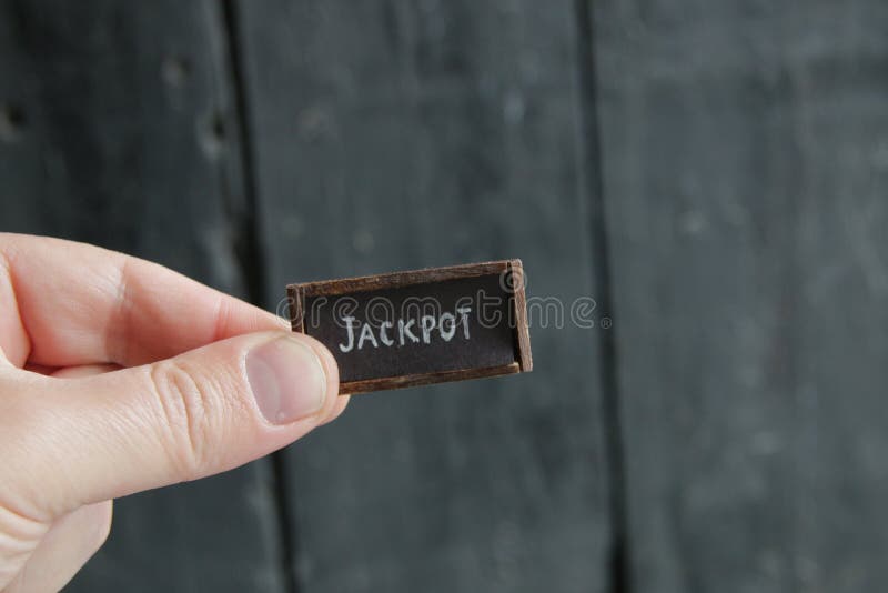 Jackpot. a Hand Holds a Sign with the Inscription. Stock Photo - Image ...