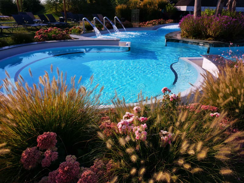 Jacuzzi and Pool with Thermal Water Surrounded by Flowers Stock Photo ...