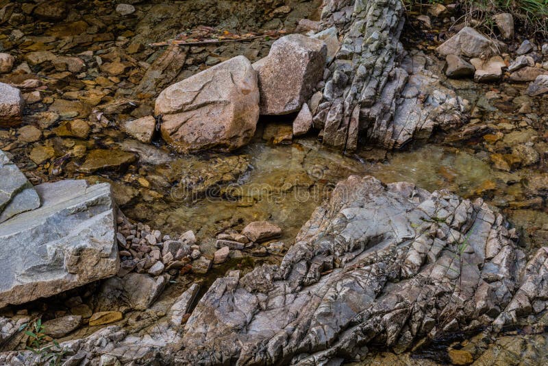 Jagged Boulders in Shallow Mountain Stream Stock Photo - Image of ...