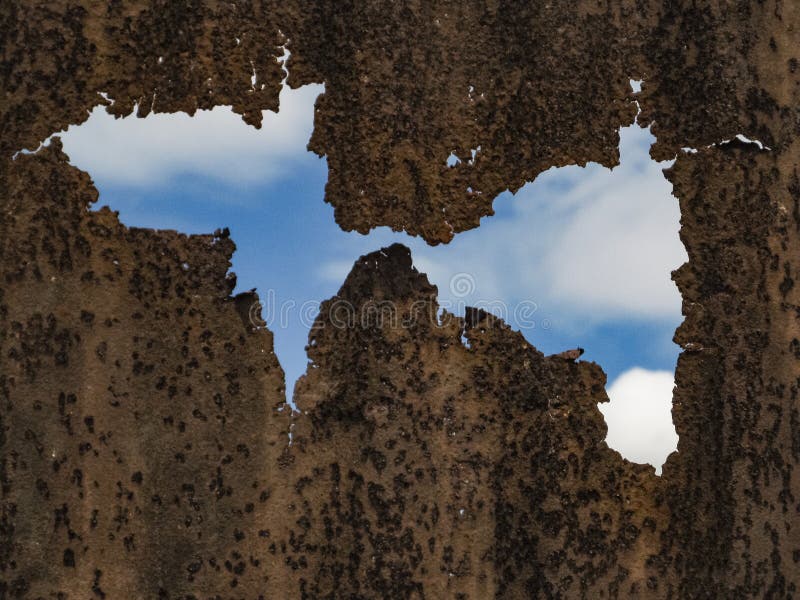 Jagged Opening in Weathered Surface Revealing Bright Blue Sky Stock ...