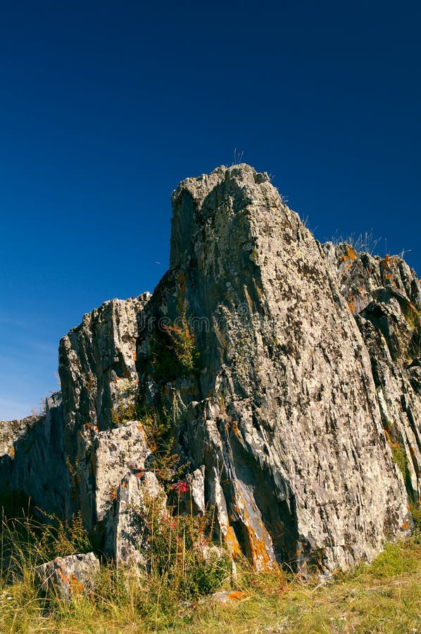 Jagged rocks and sky stock photo. Image of grass, outdoor - 16991316