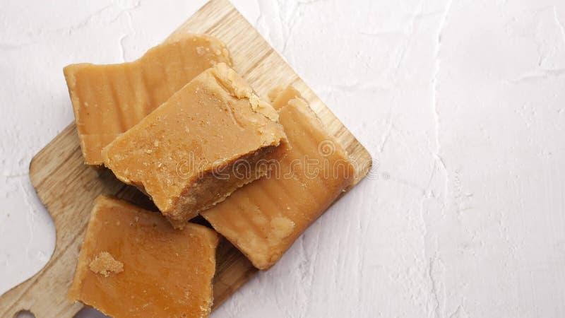 Top View of Jaggery Traditional Cane Sugar Cube on Table Stock Footage ...