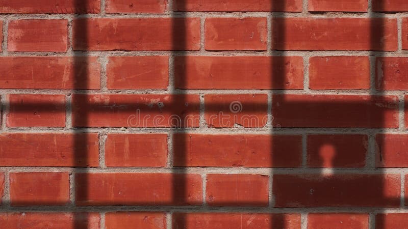 Jail Shadow on Red Bricks Wall. Stock Photo - Image of depression ...