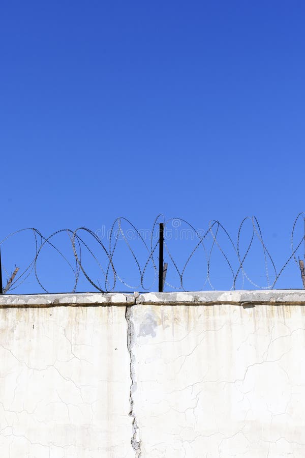 Jail Wall. Highly Protected Prison Wall with Barbed Wire Fence Stock ...