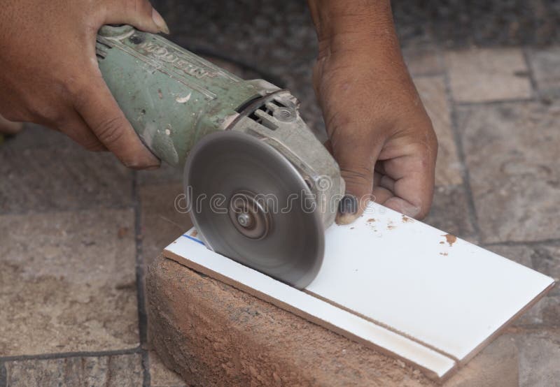 Craftsman Cutting Ceramics Using a Cutting Machine Stock Image - Image ...