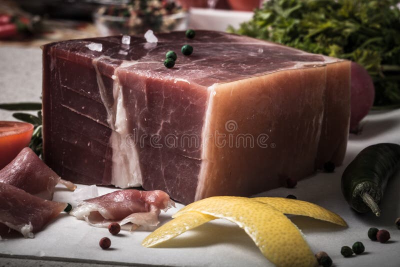 Jamon Piece Lying on the Table with Spices. Tinted Stock Image - Image ...