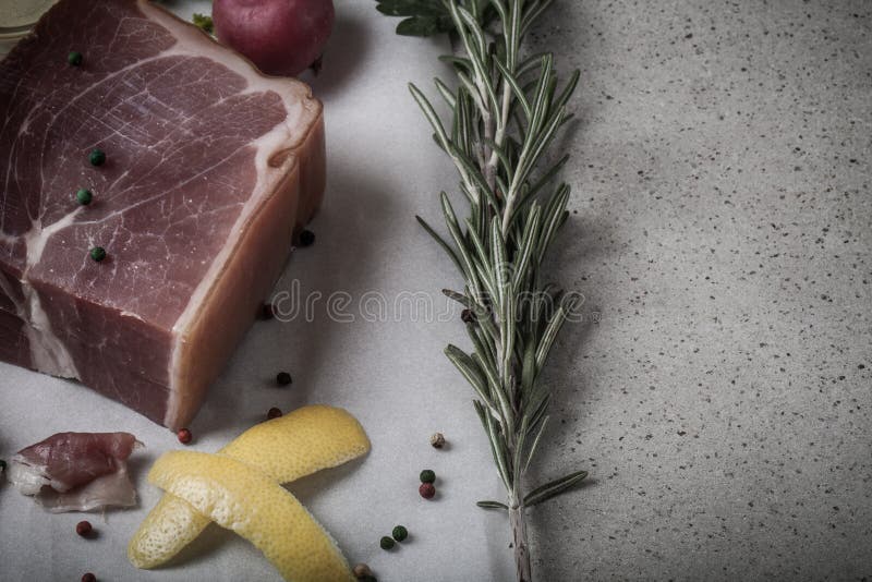 Jamon Piece Lying on the Table with Spices. Tinted Stock Image - Image ...